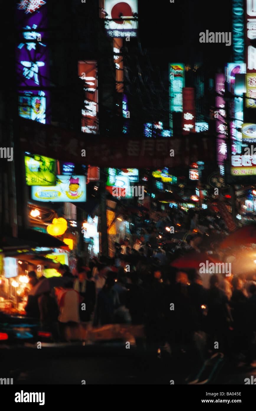 Crowded city street at night Stock Photo - Alamy