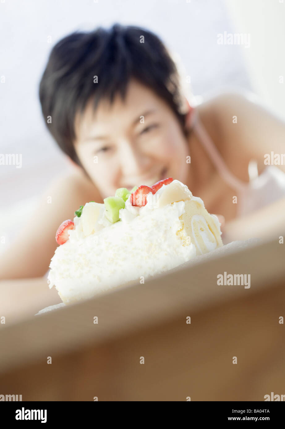 A woman looking at cake Stock Photo - Alamy