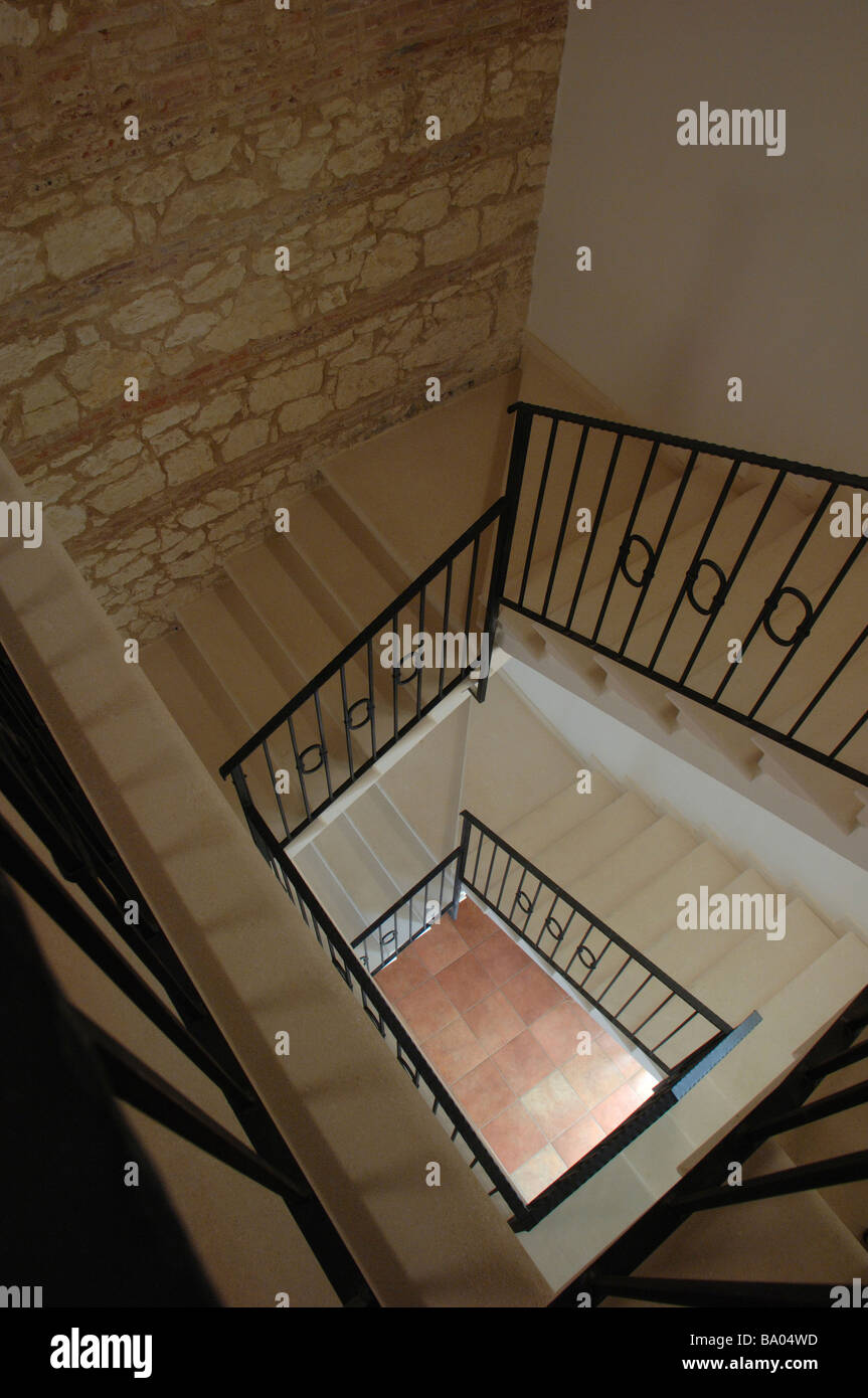 Winding stone staircase with iron banisters in a Italian Farmhouse ...