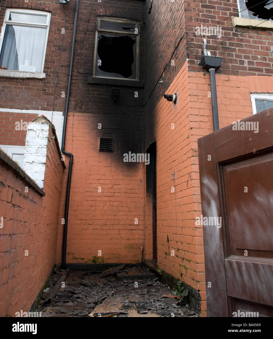 House bedroom fire showing burnt out window Stock Photo - Alamy
