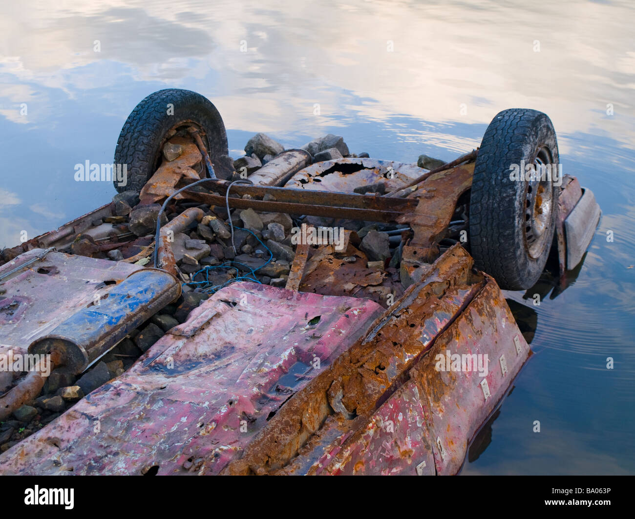 Rusty Dumped Car in Water Pond Lake Polluting Stock Photo - Alamy