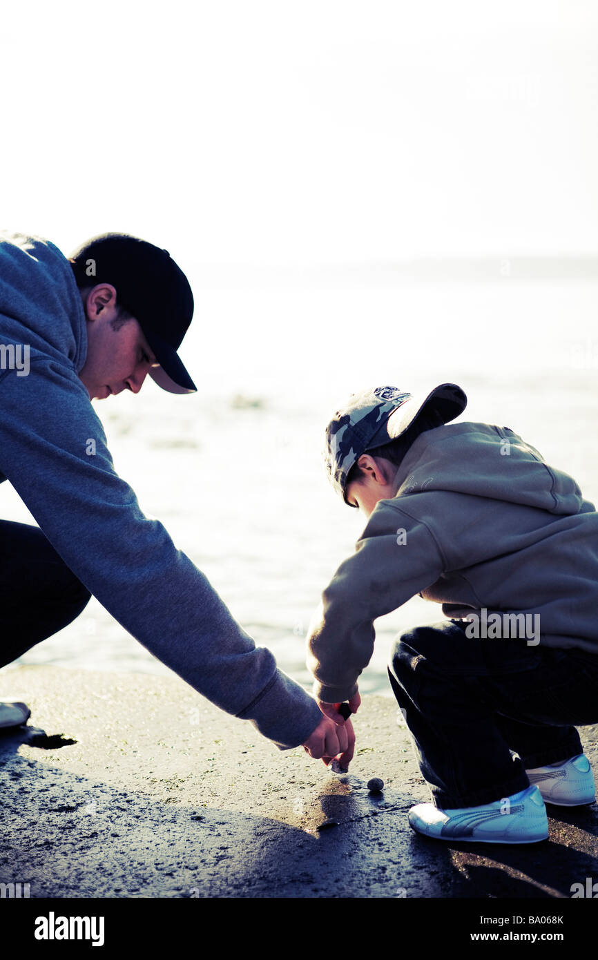 Exploring at the beach Stock Photo - Alamy