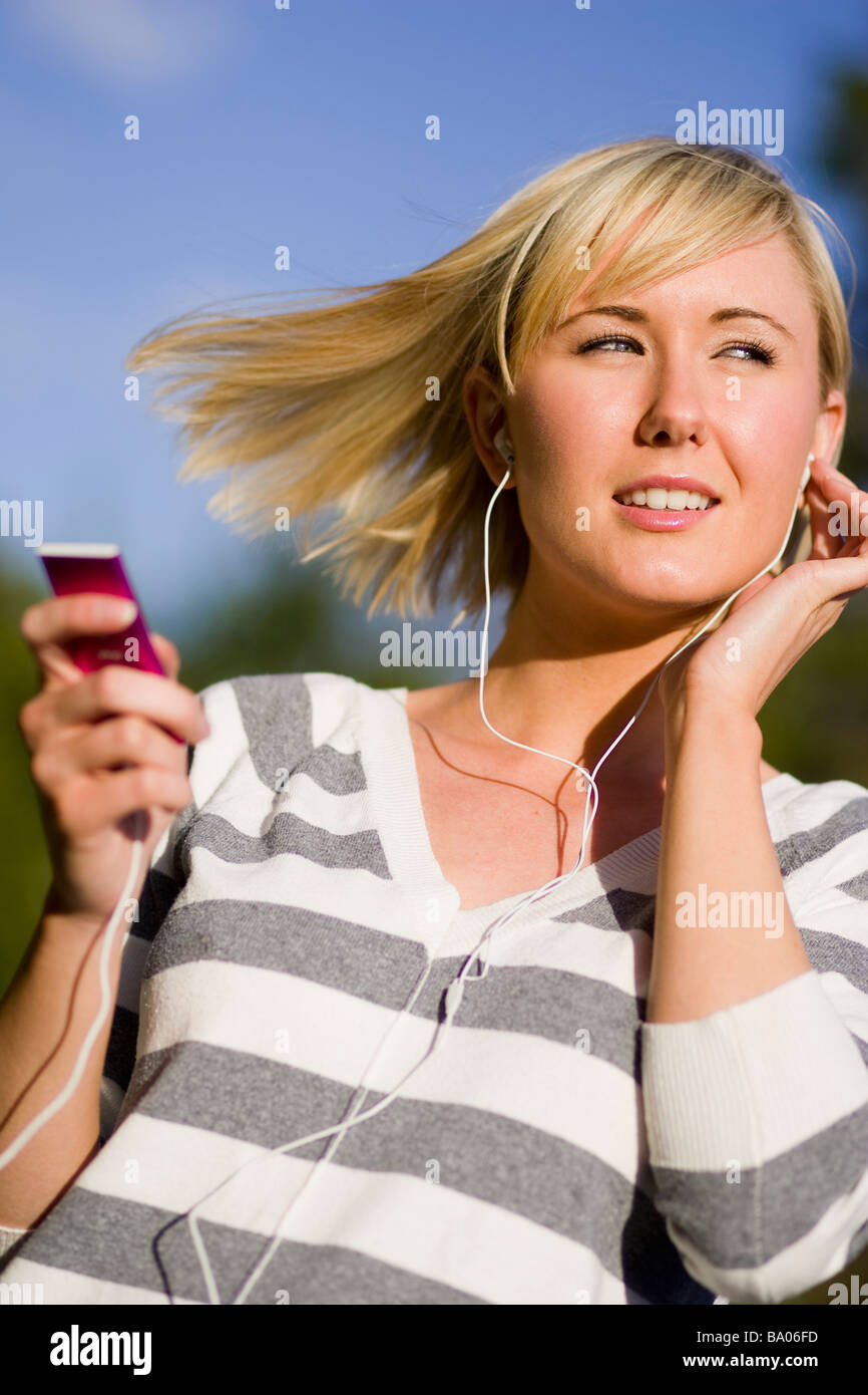 Girl listening to 'iPod' Stock Photo - Alamy