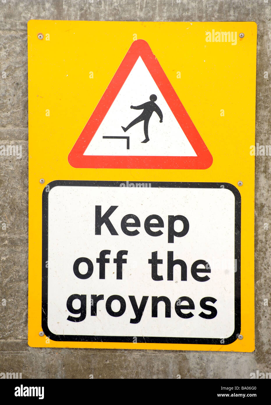 A keep off the groynes warning sign on the undercliff path between ...