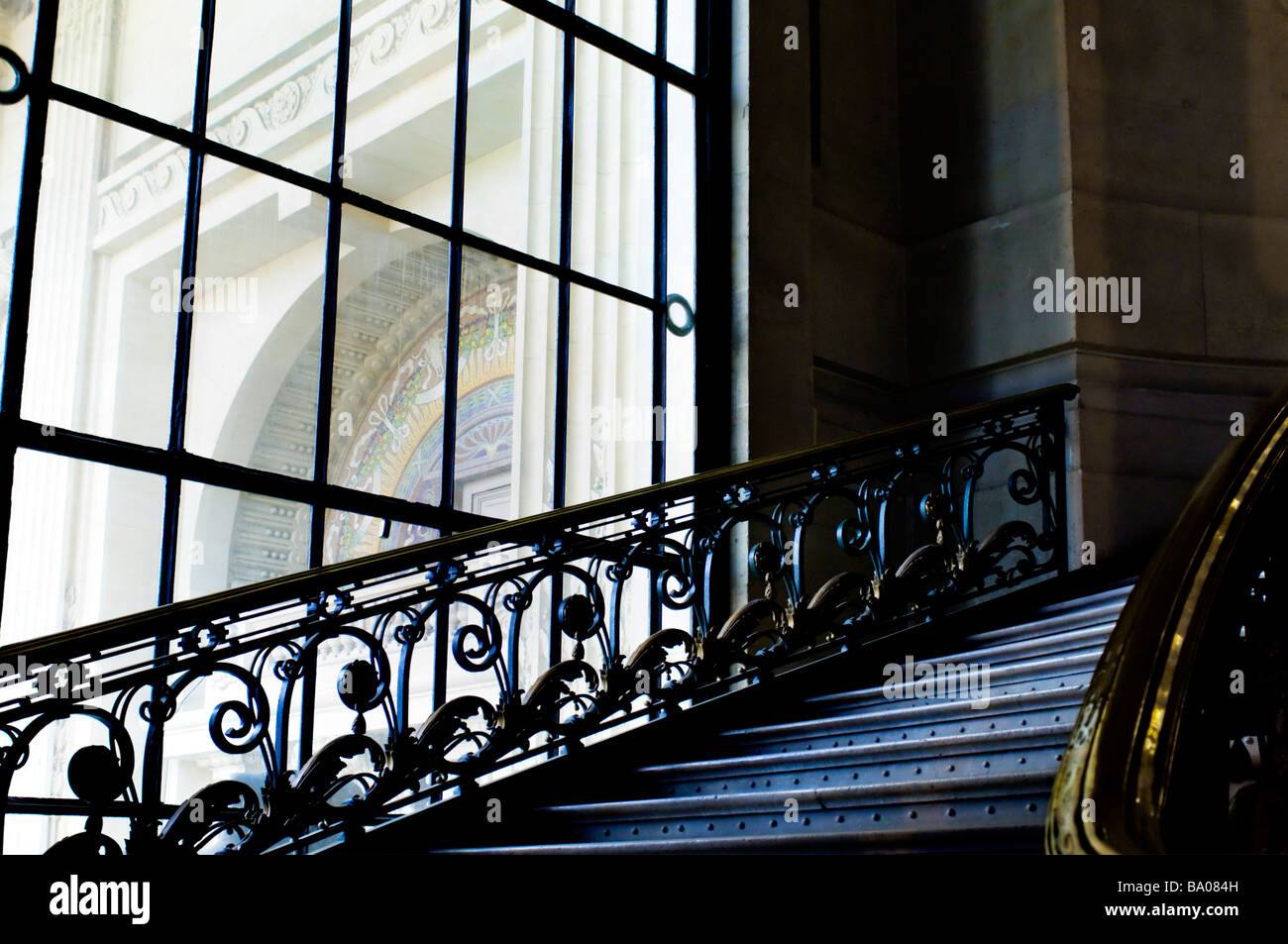 Staircase and exterior facade shown through windows at the Grand Palace ...