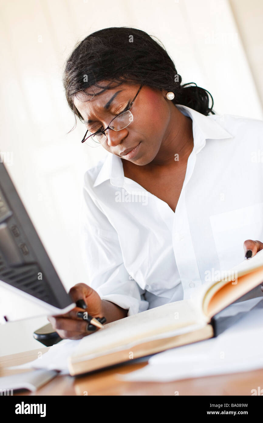 Ethnic woman at computer Stock Photo - Alamy