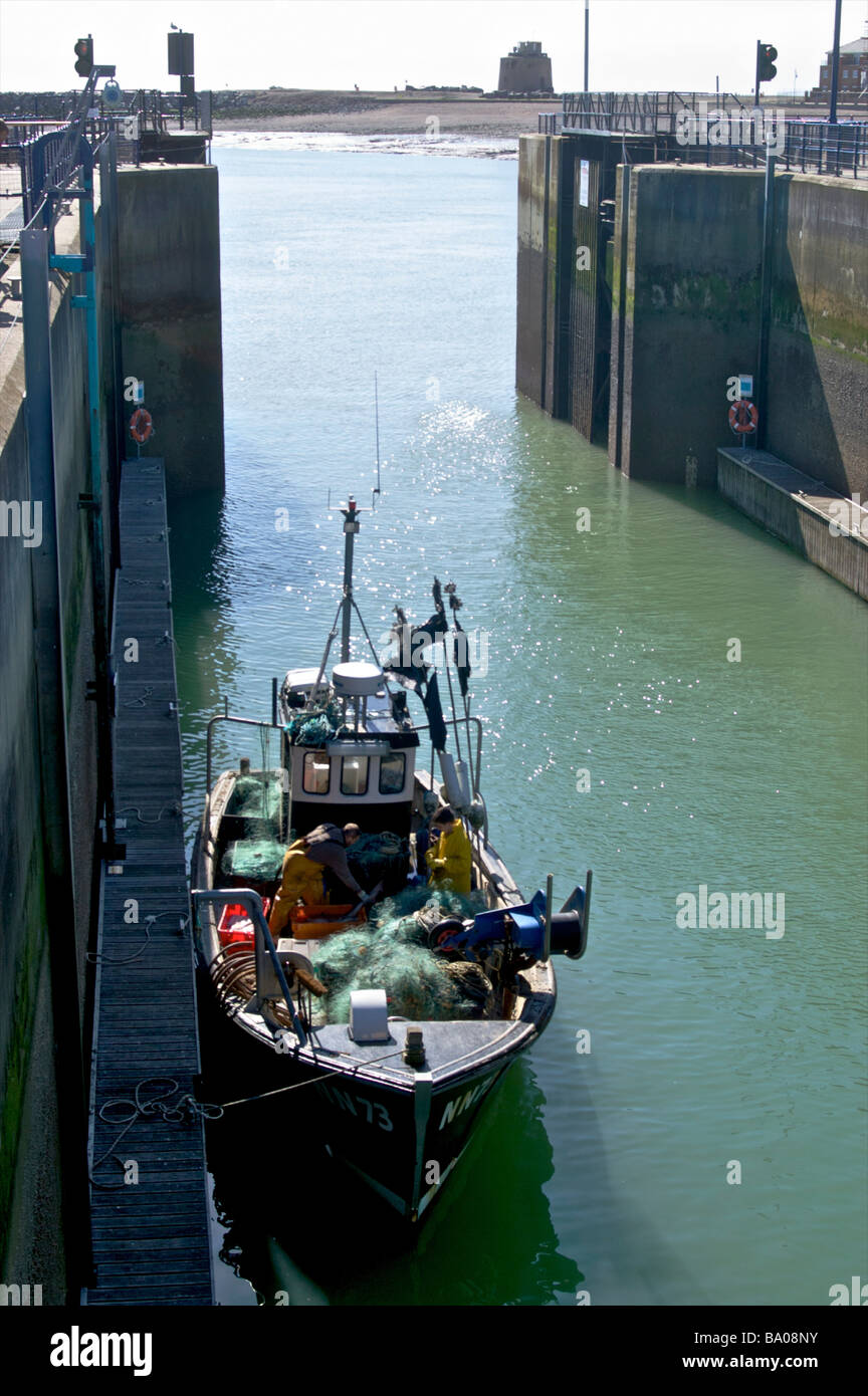 Fishing boat locking in at Sovereign Harbour Marina, East Sussex ...