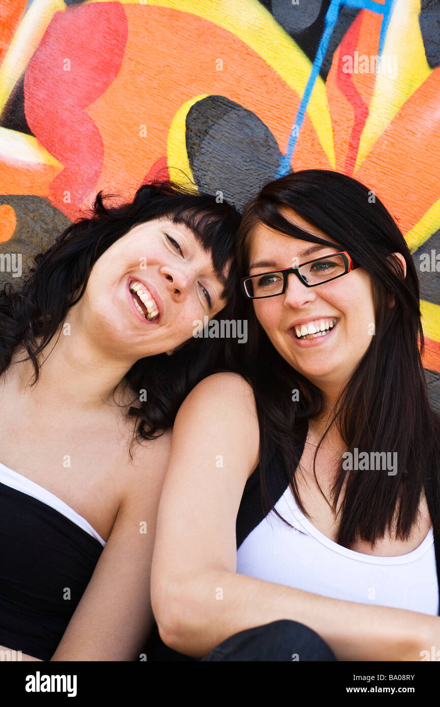 Two women laughing together Stock Photo - Alamy