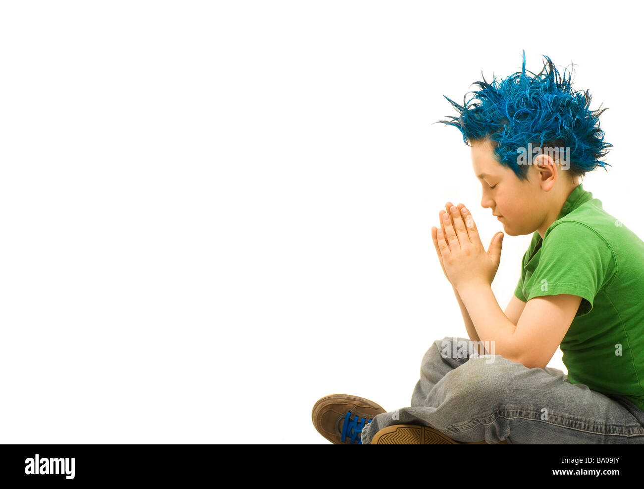 Blue haired boy praying Stock Photo - Alamy