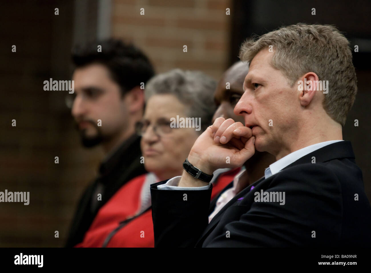Dr. James Orbinski looks on during a discussion panel at a conference ...