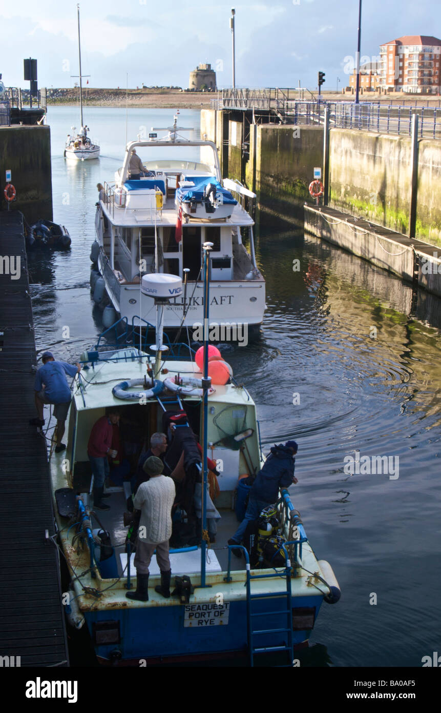 boats locking out at Sovereign Harbour Marina, East Sussex, England ...