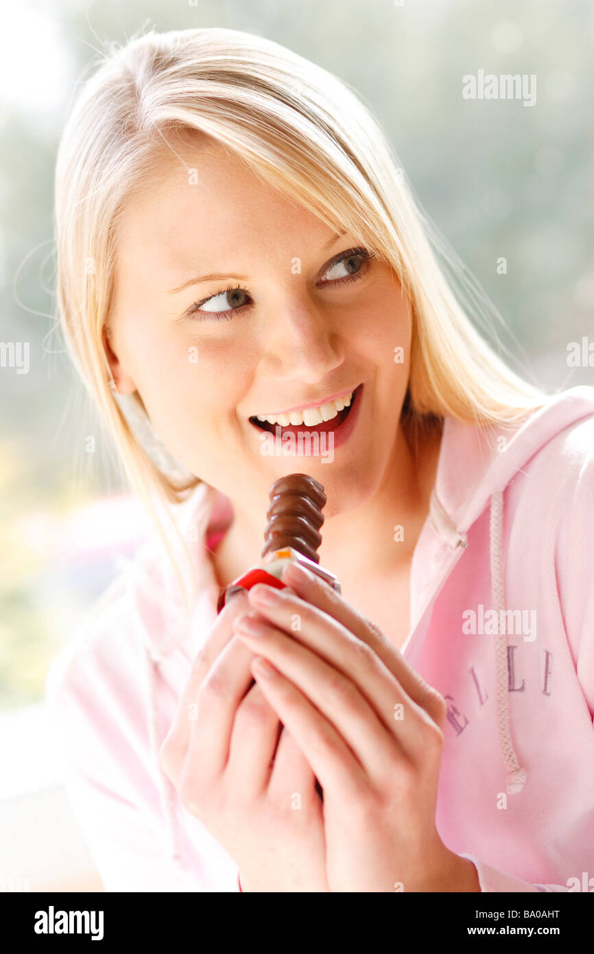 Girl with chocolate bar Stock Photo - Alamy
