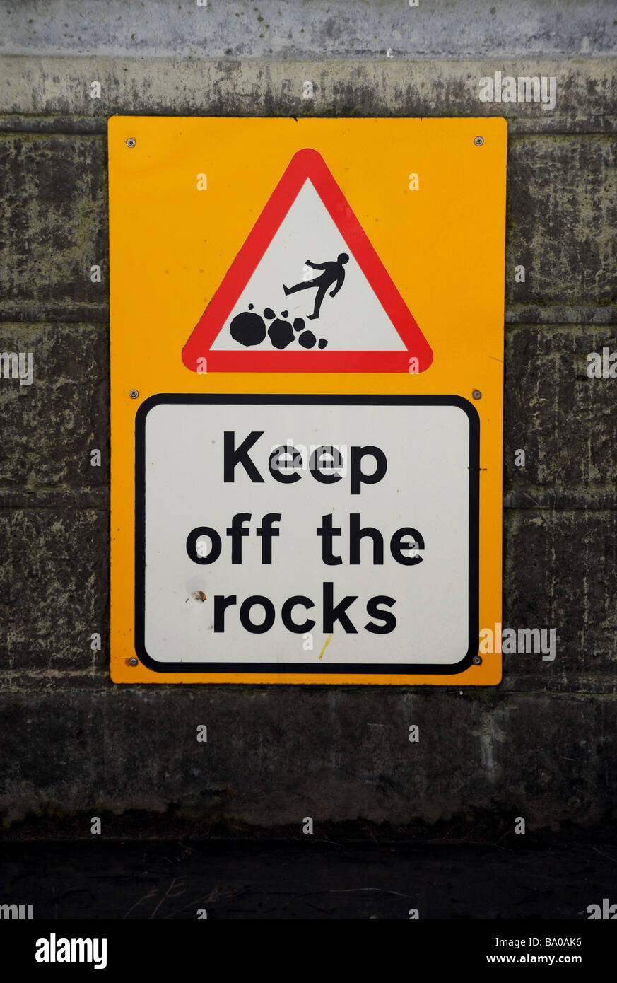 A keep off the rocks warning sign Stock Photo - Alamy