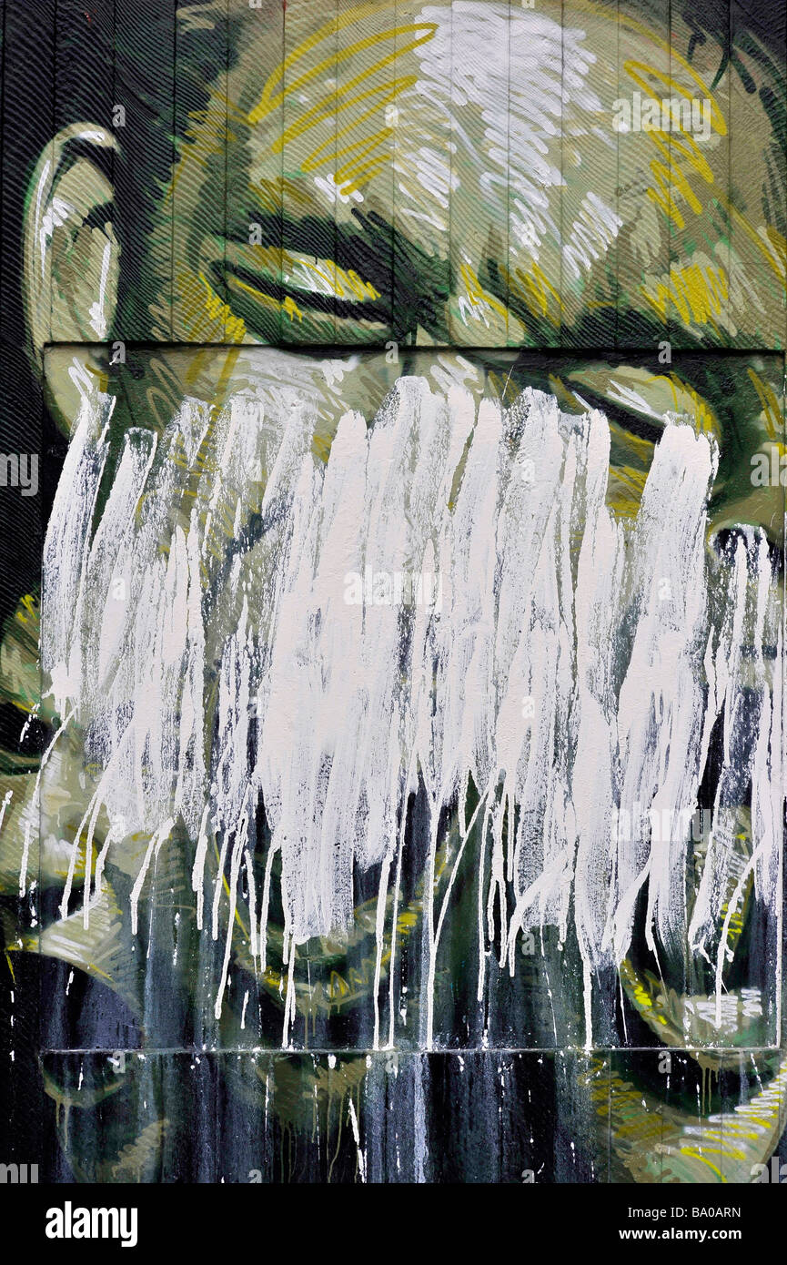 defaced graffiti face northern quarter manchester Stock Photo - Alamy