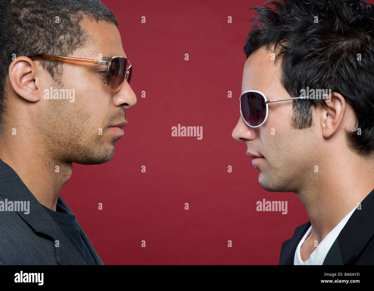Two men looking at each other Stock Photo - Alamy