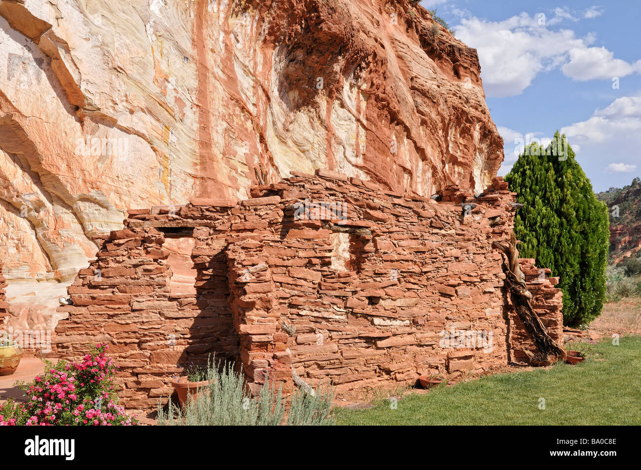 ancient fortress under red rock Stock Photo - Alamy