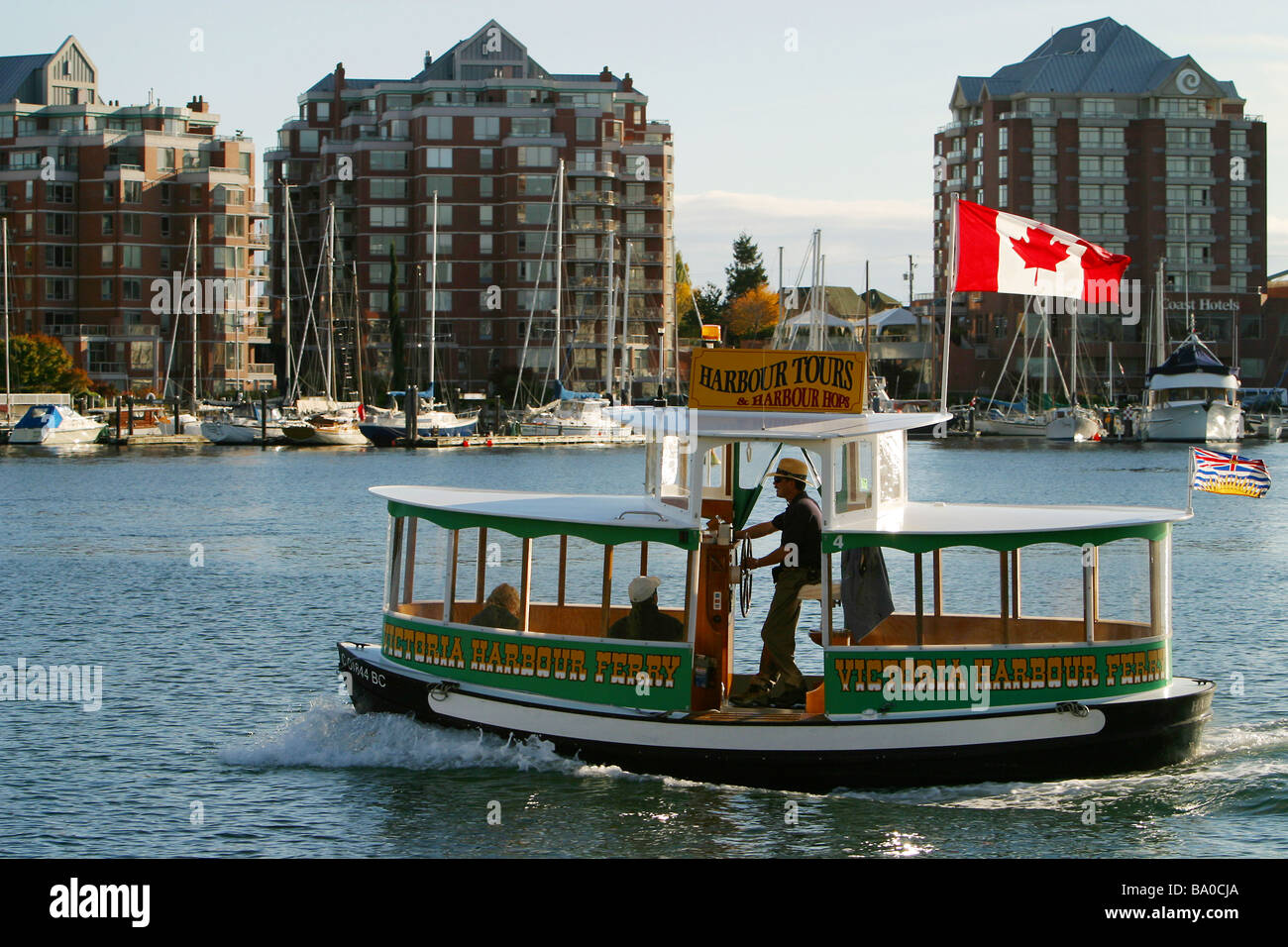 A small passenger ferry, known as a "Harbour Ferry" takes passengers on ...