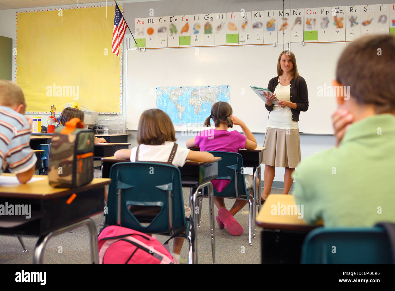 Teacher up in front of school class Stock Photo - Alamy