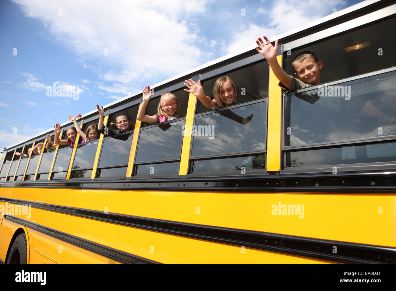 Children waving from school bus windows Stock Photo: 23367205 - Alamy