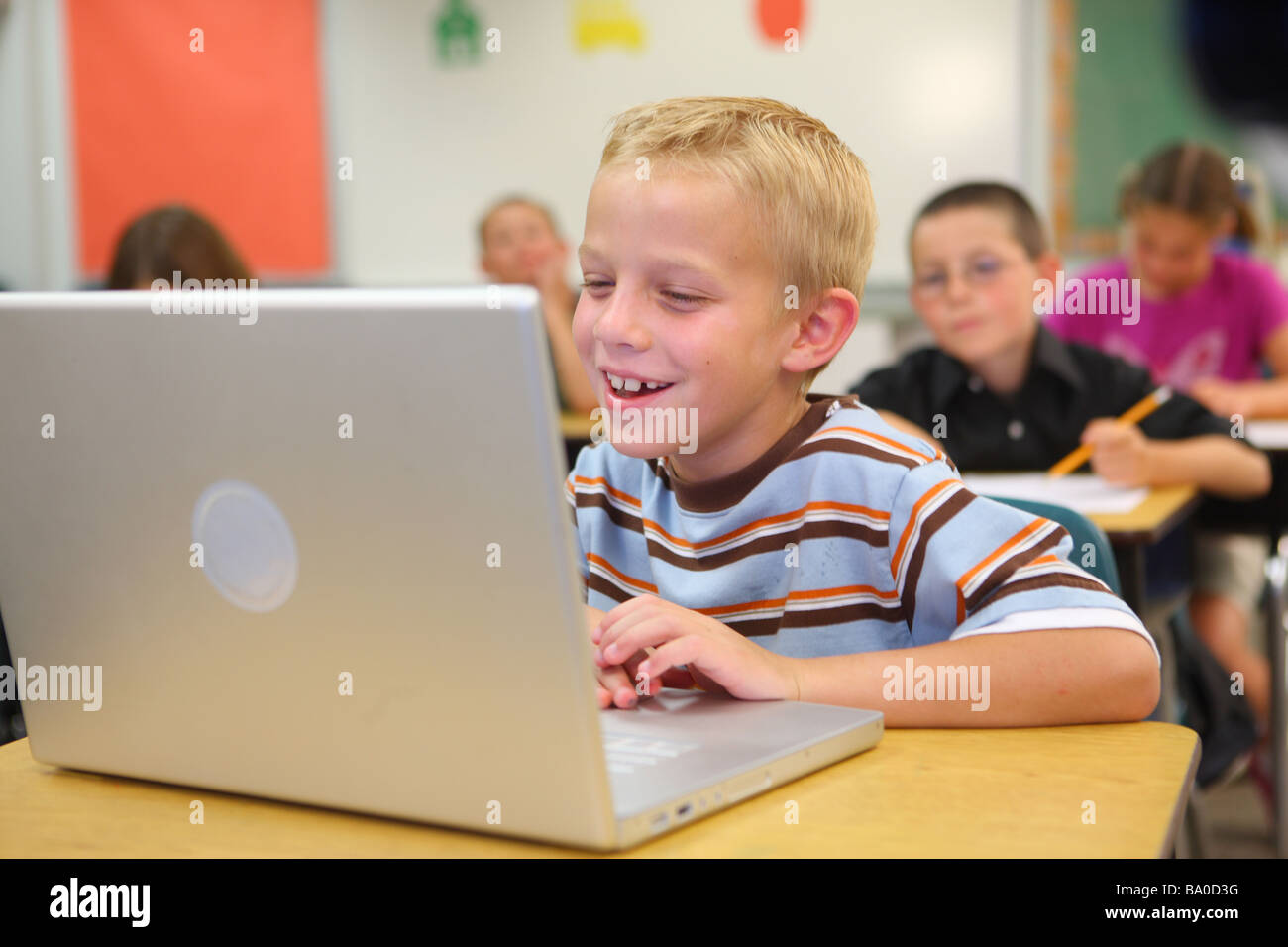 School student working on laptop Stock Photo - Alamy