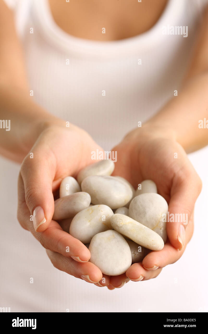 Hands holding stones Stock Photo - Alamy