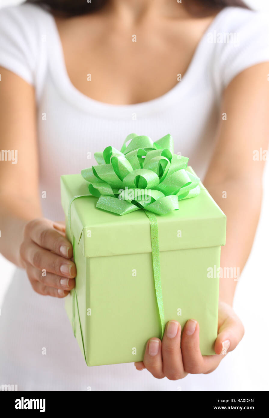 Hands holding present Stock Photo - Alamy