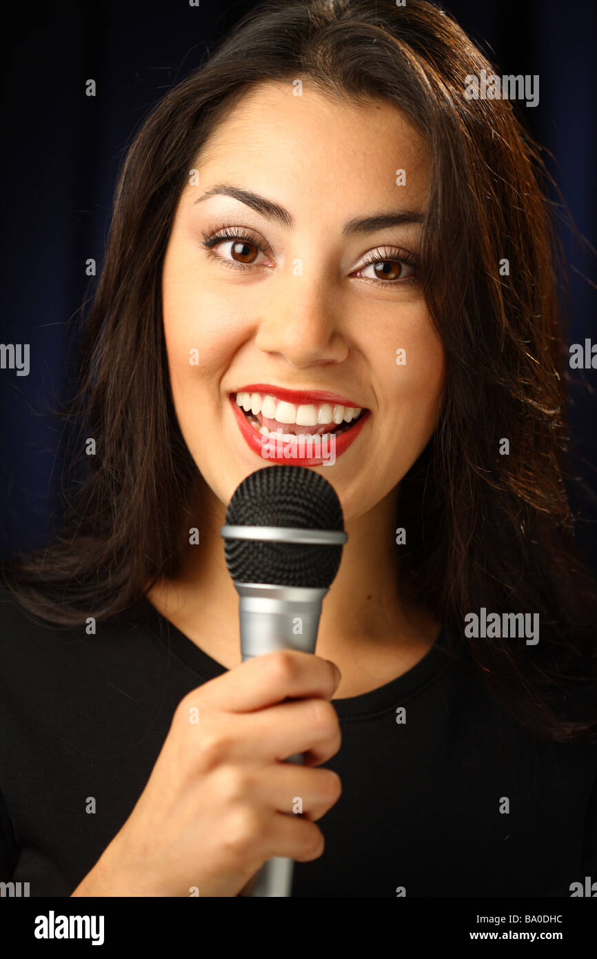 Woman with microphone Stock Photo - Alamy