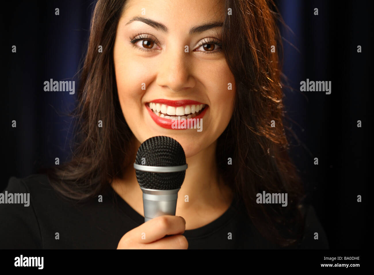 Woman with microphone Stock Photo - Alamy