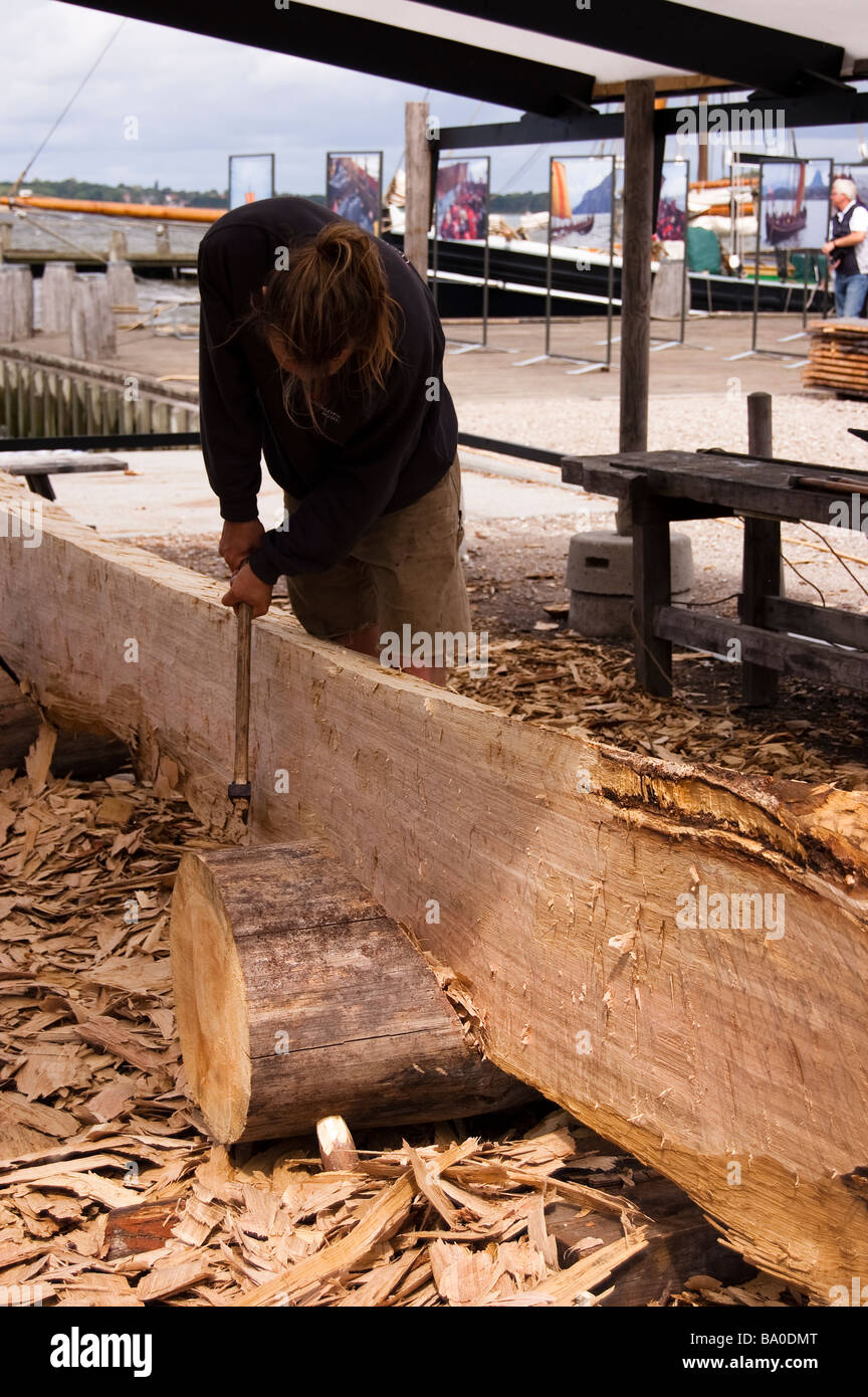 Man chopping wood with an axe Stock Photo - Alamy