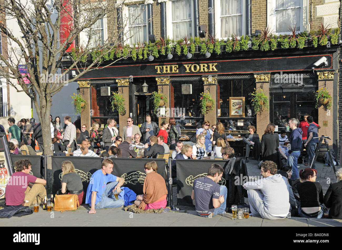 People sitting outside The York Public House on a sunny day Islington ...