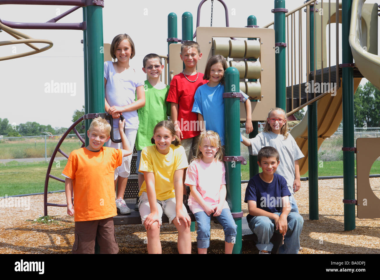 Group of school children on play structure Stock Photo - Alamy