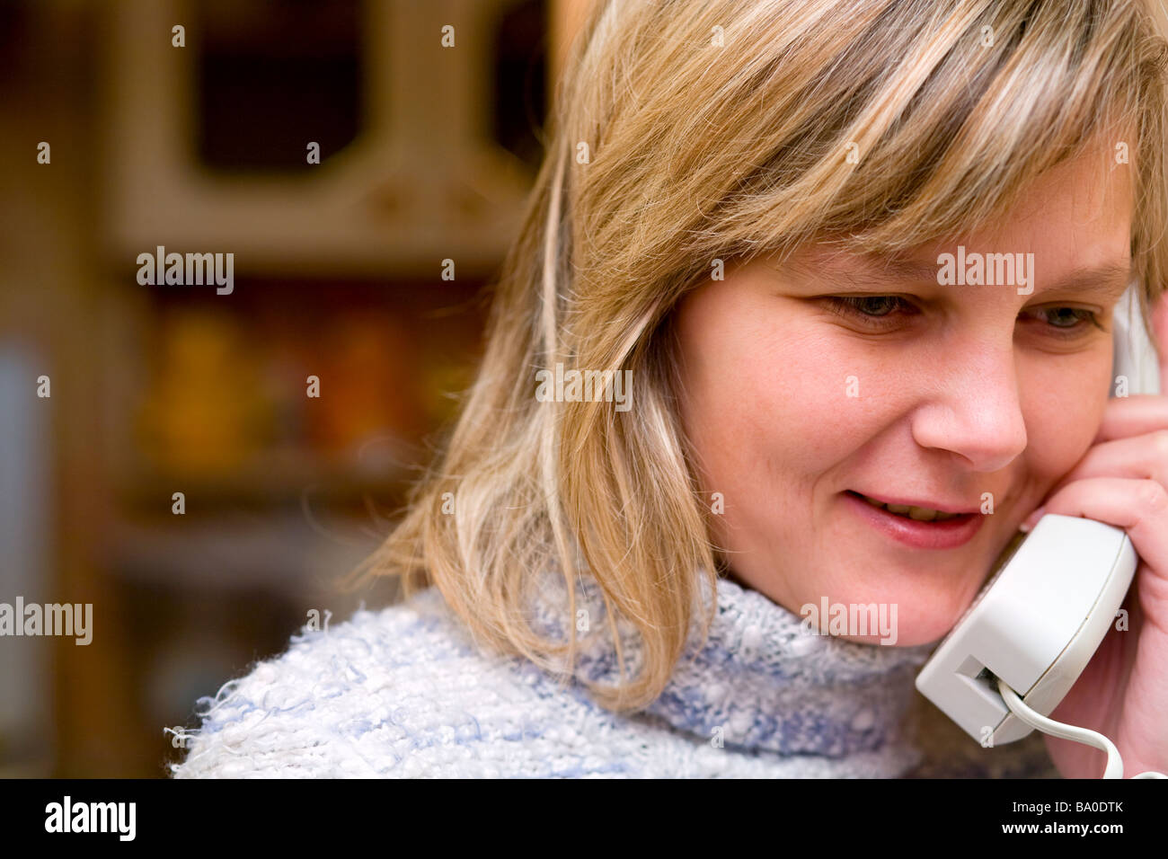talking by phone woman facial close-up portret (indoor Stock Photo - Alamy