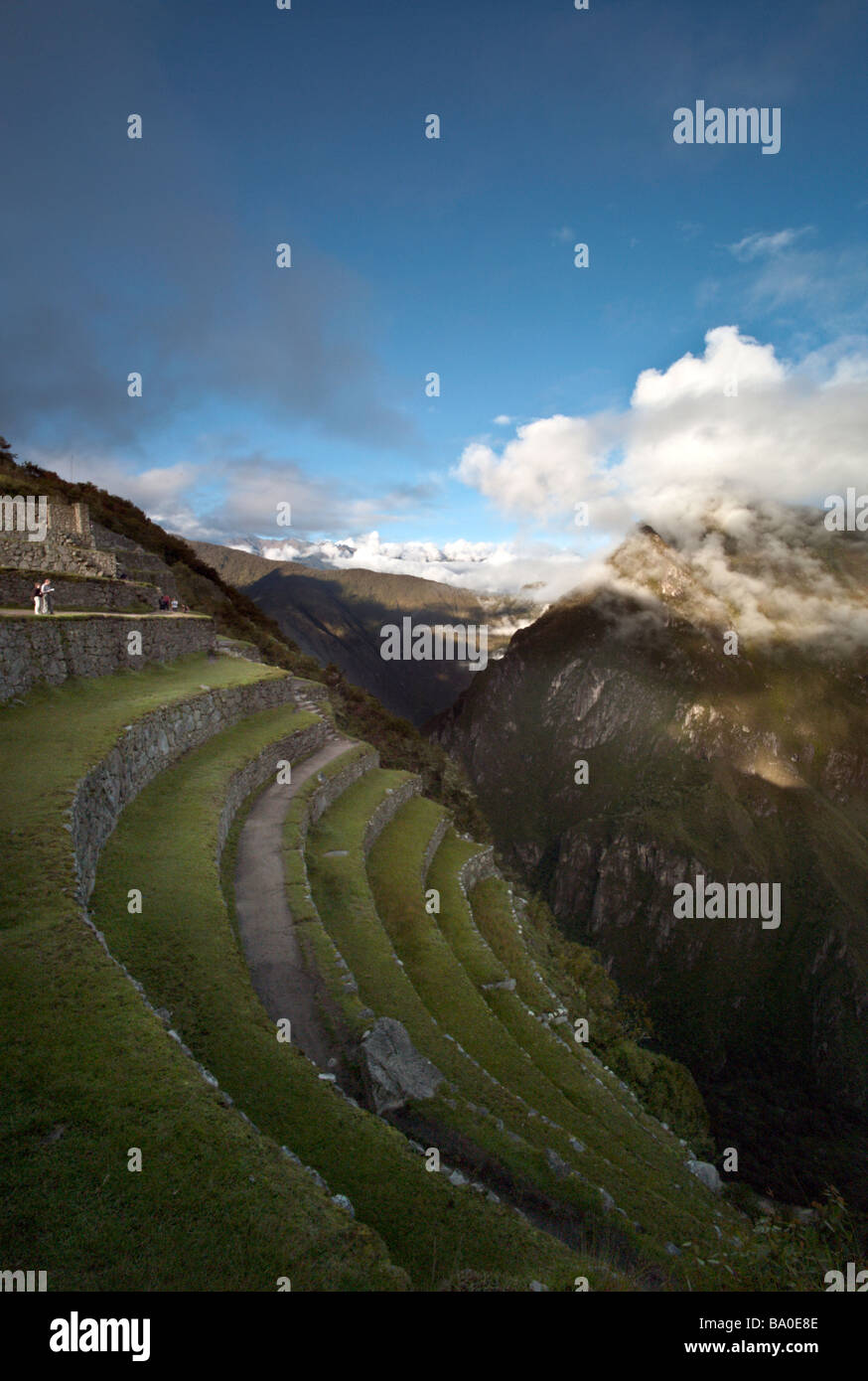 PERU MACHU PICCHU Sunrise hitting the Inca Terraces of Machu Picchu ...