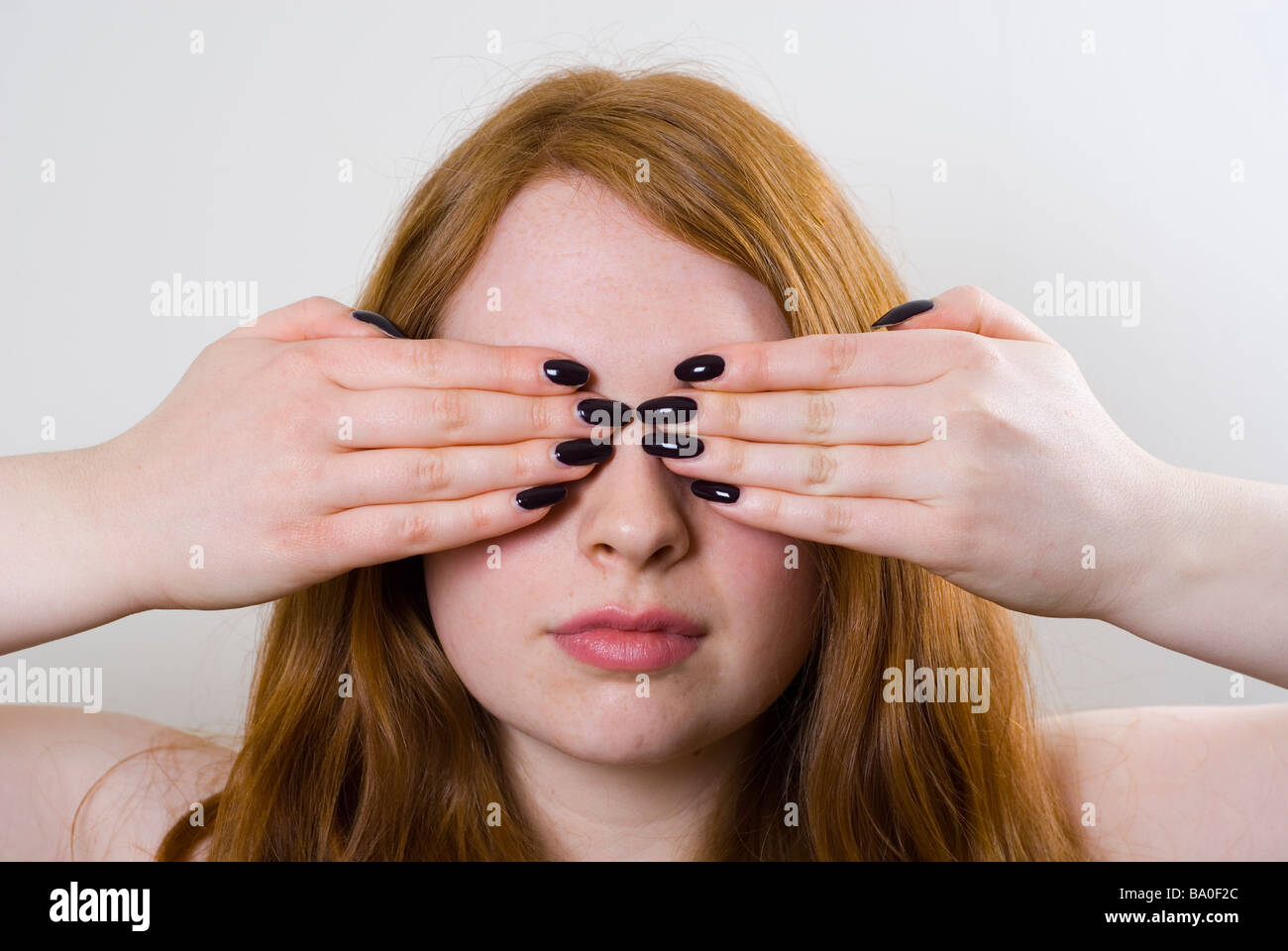 Young woman hands covering eyes Stock Photo - Alamy