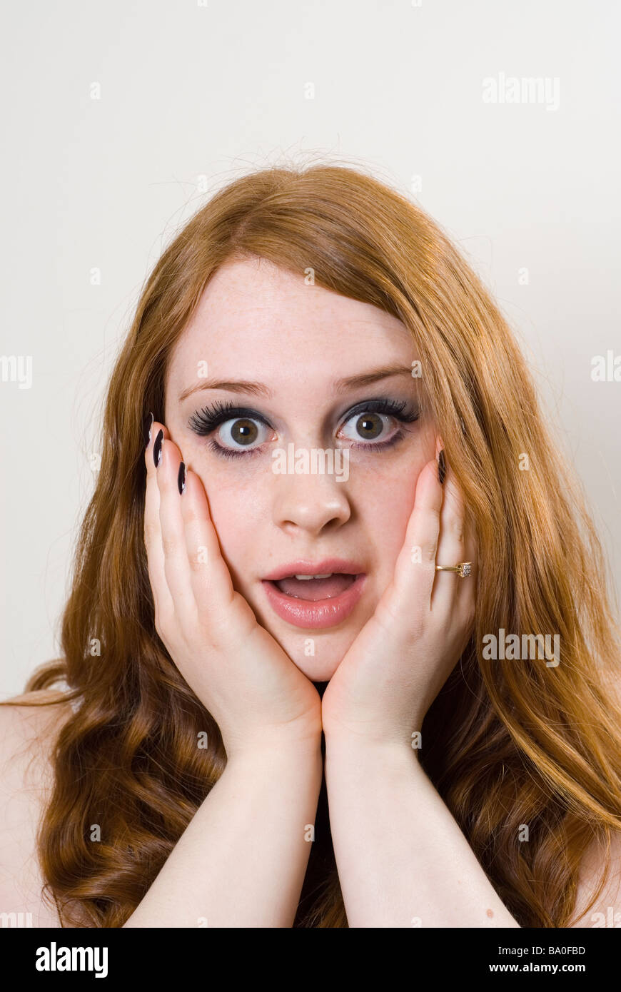 Young woman in shock Stock Photo - Alamy