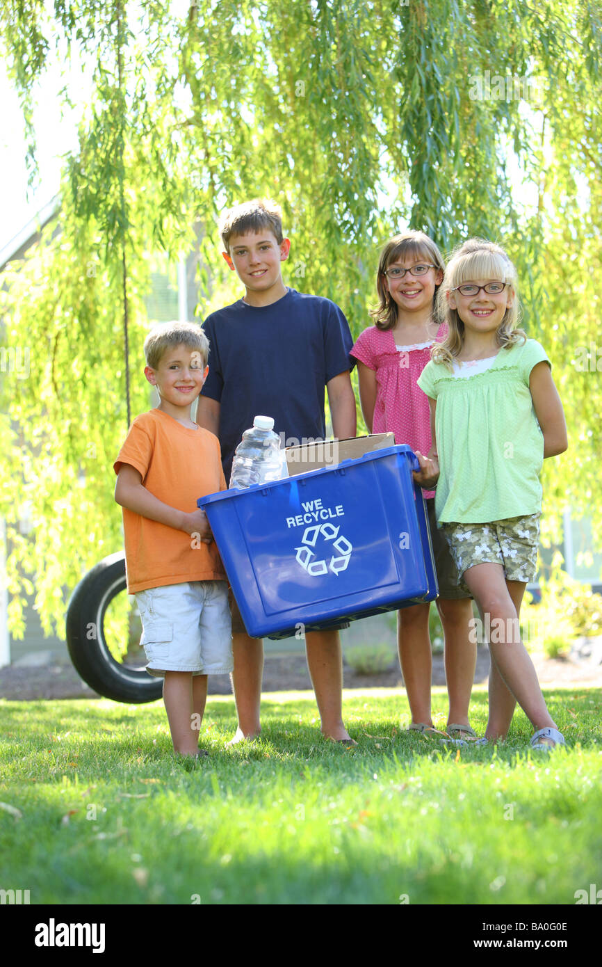 Group of children outdoors with recycle bin Stock Photo - Alamy