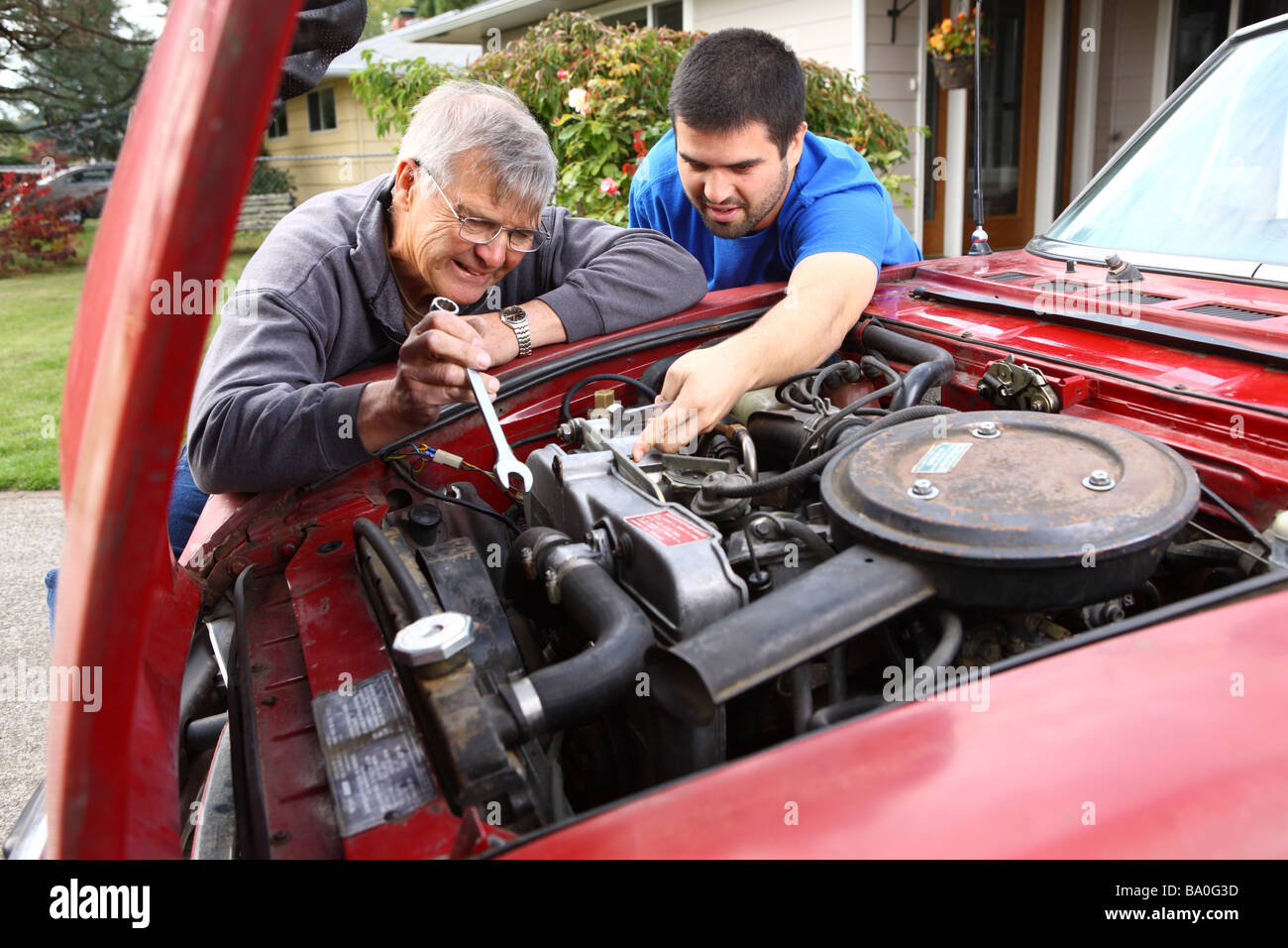 Vintage men working on car hi-res stock photography and images - Alamy