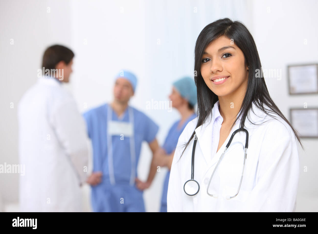 Portrait of nurse with medical personnel in background Stock Photo - Alamy