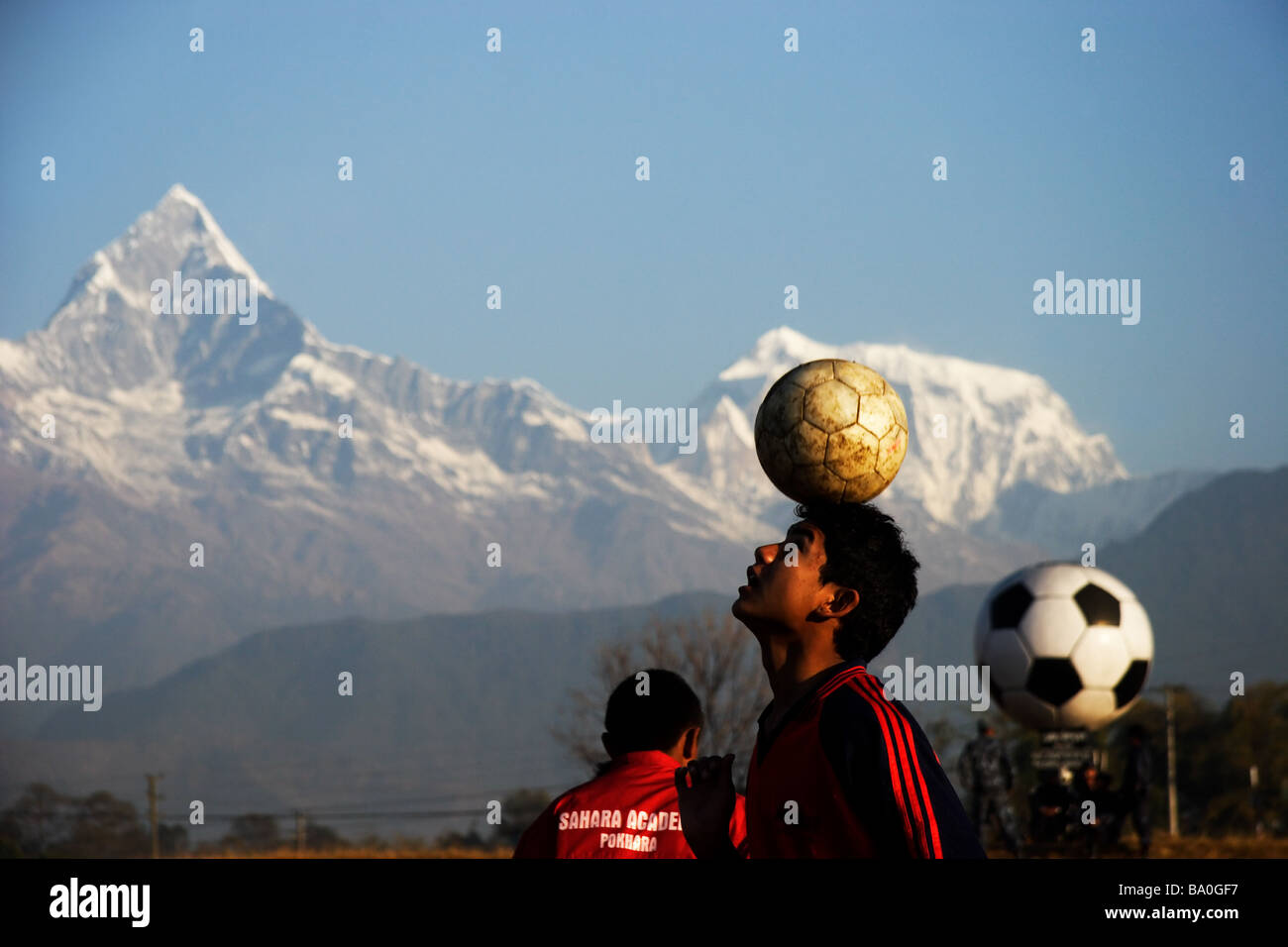 Asian children playing soccer hi-res stock photography and images - Alamy