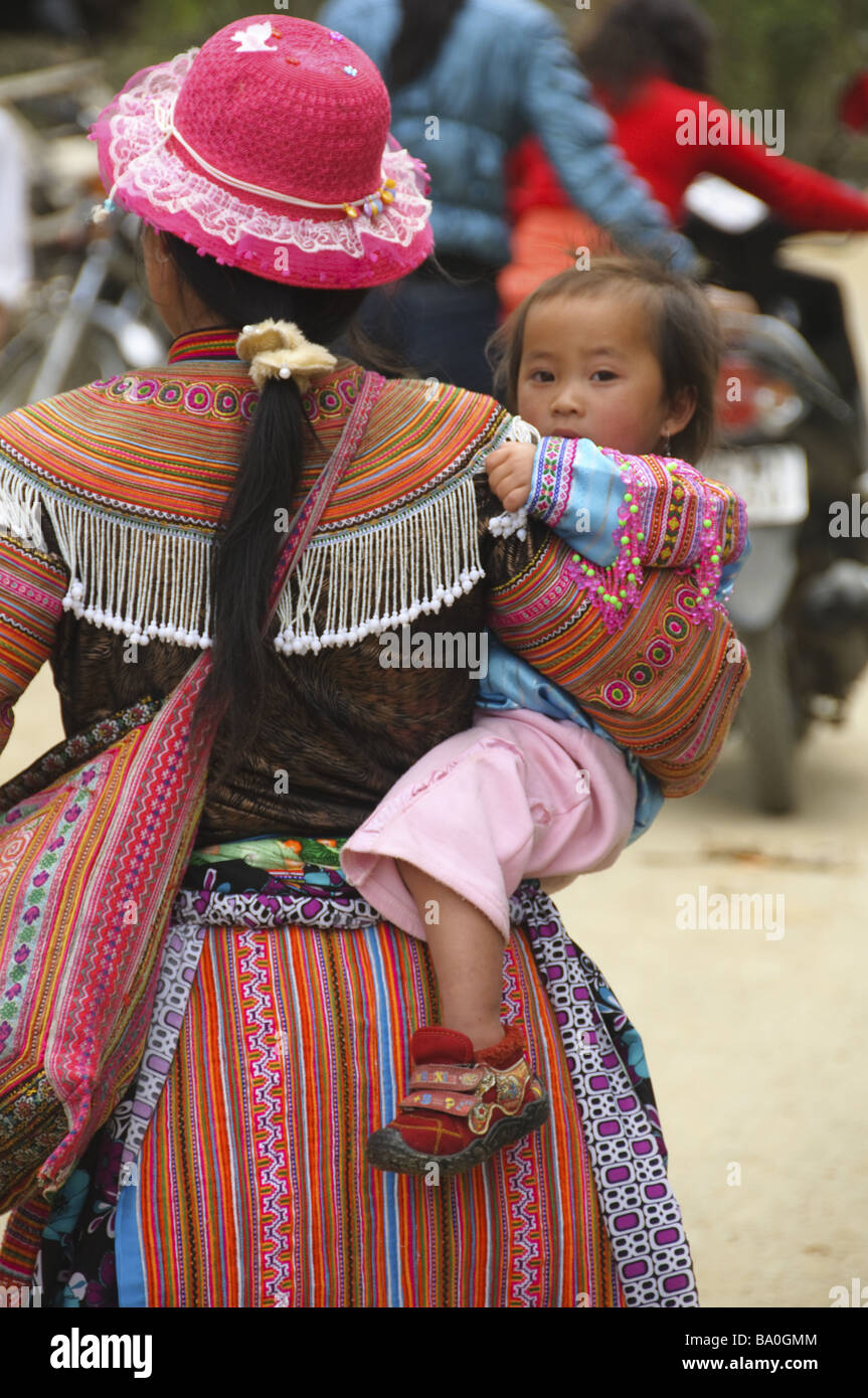 colorful Flower Hmong woman and her baby in the market in Cau Son near ...