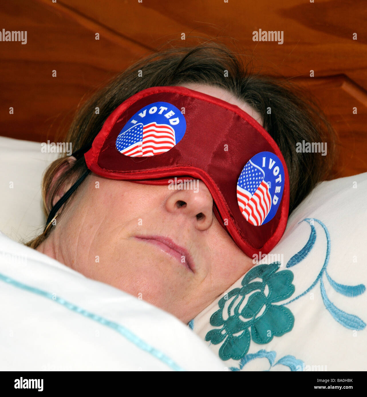 Woman wearing I voted sticker on her sleeping eye shade Stock Photo - Alamy