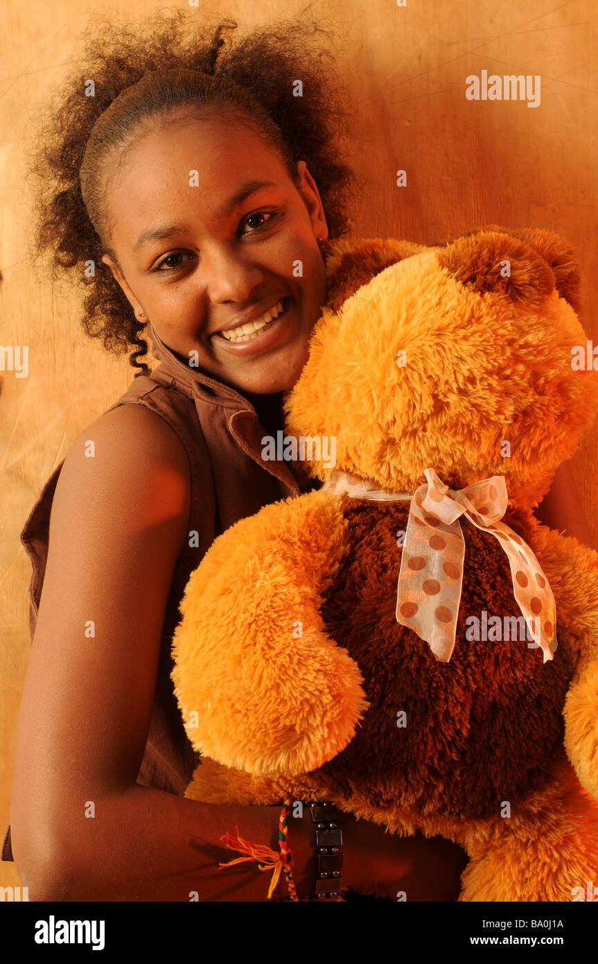 black african girl with cuddly toy Stock Photo - Alamy