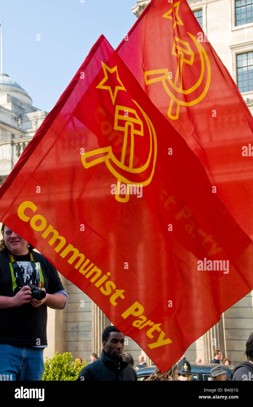 Two communist party flags outside the Bank of England at the G20 Summit ...