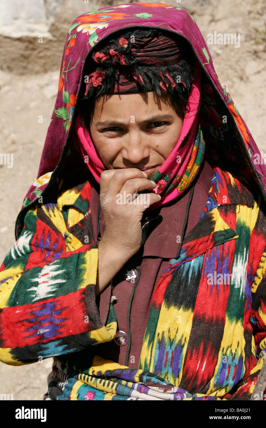 Tajik woman wearing traditional dress and hat, Marguzor Lakes, Fan ...
