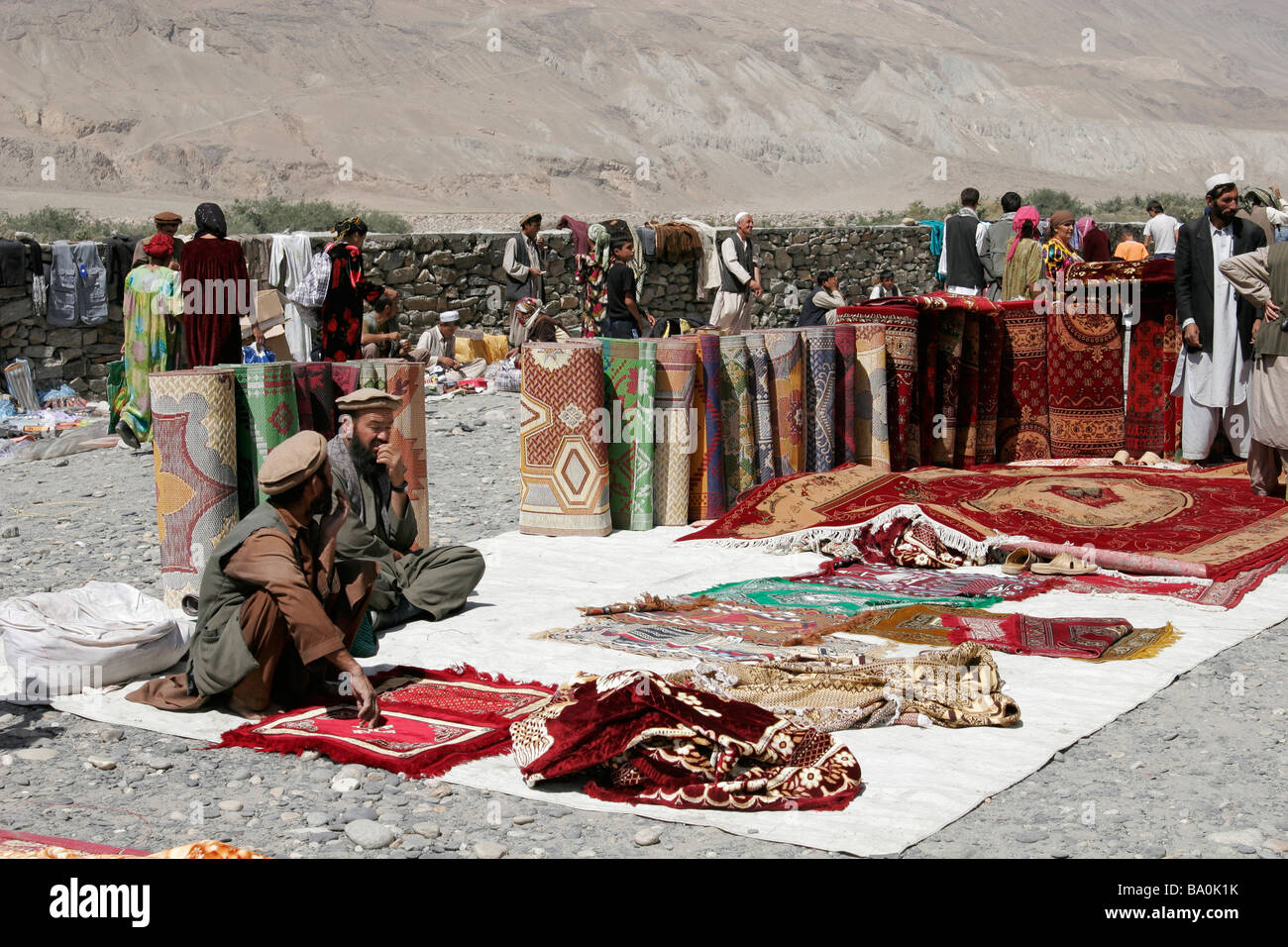 Afghan carpet sellers on the transborder market near Ishkashim on the ...