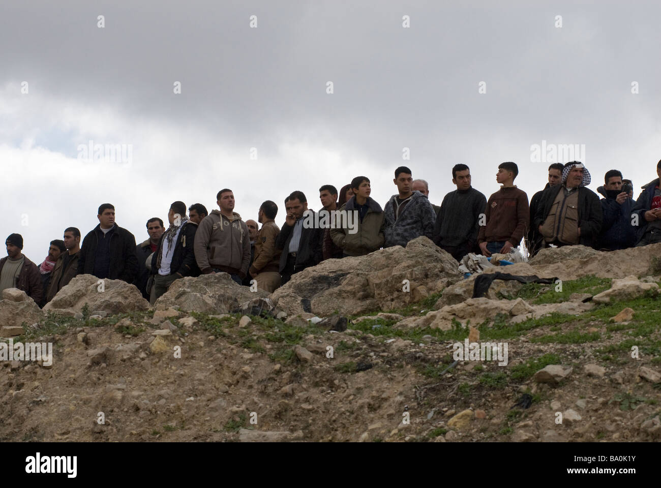 Local Palestinian men waiting in a military roadblock in outskirts of ...