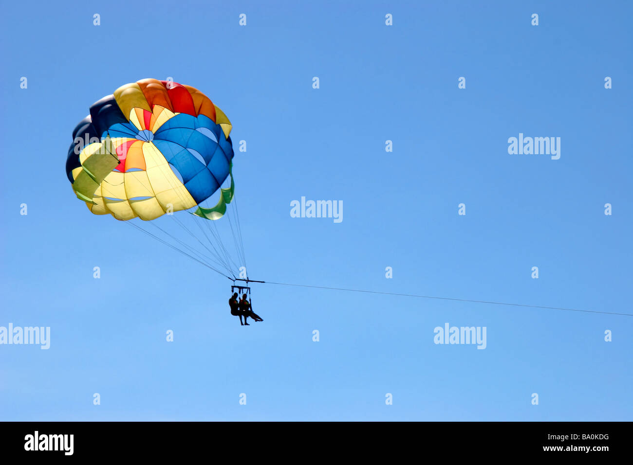 Two people paragliding off a beach in Gran Canaria Stock Photo - Alamy