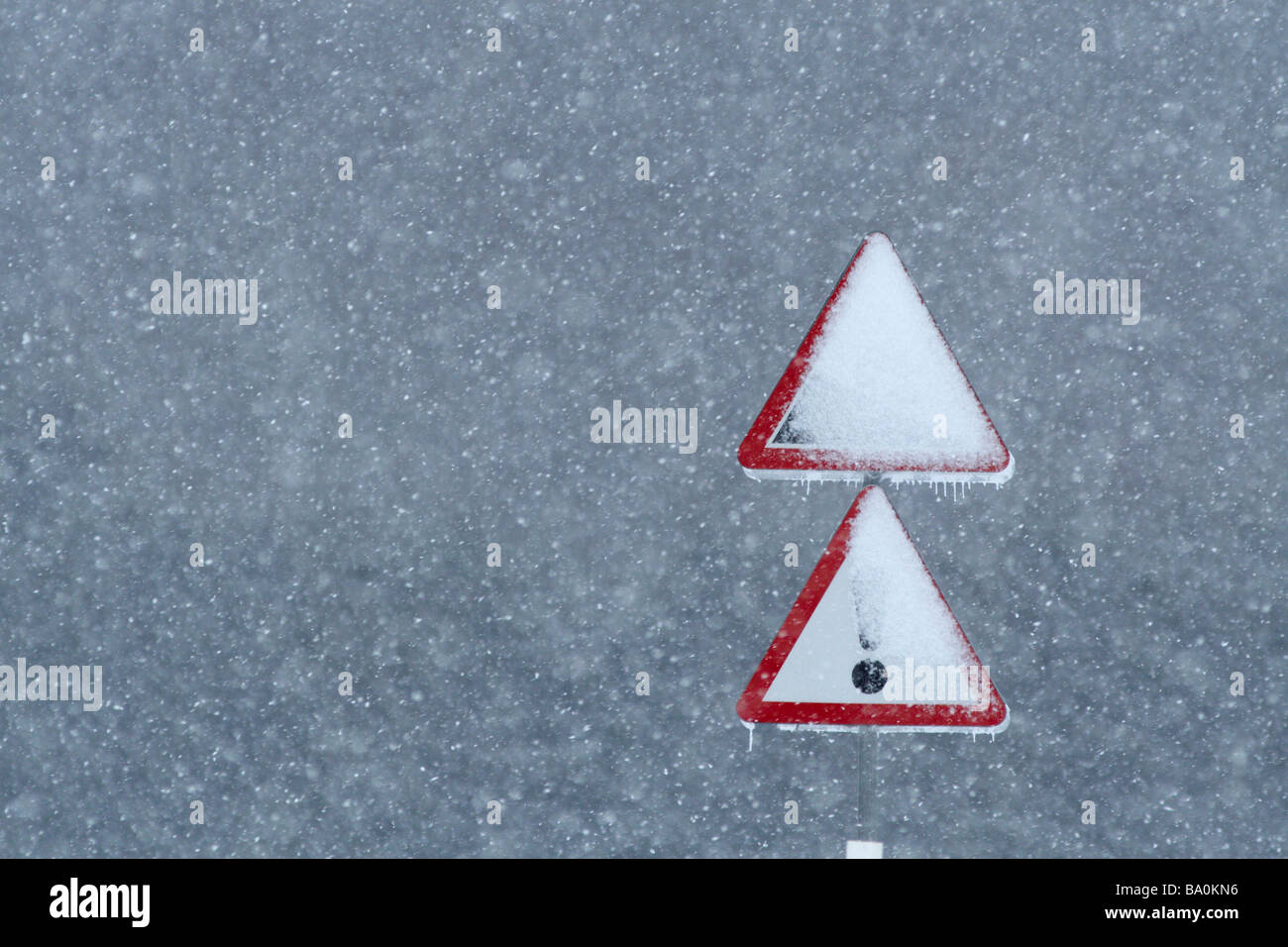 Road sign covered with snow Stock Photo - Alamy