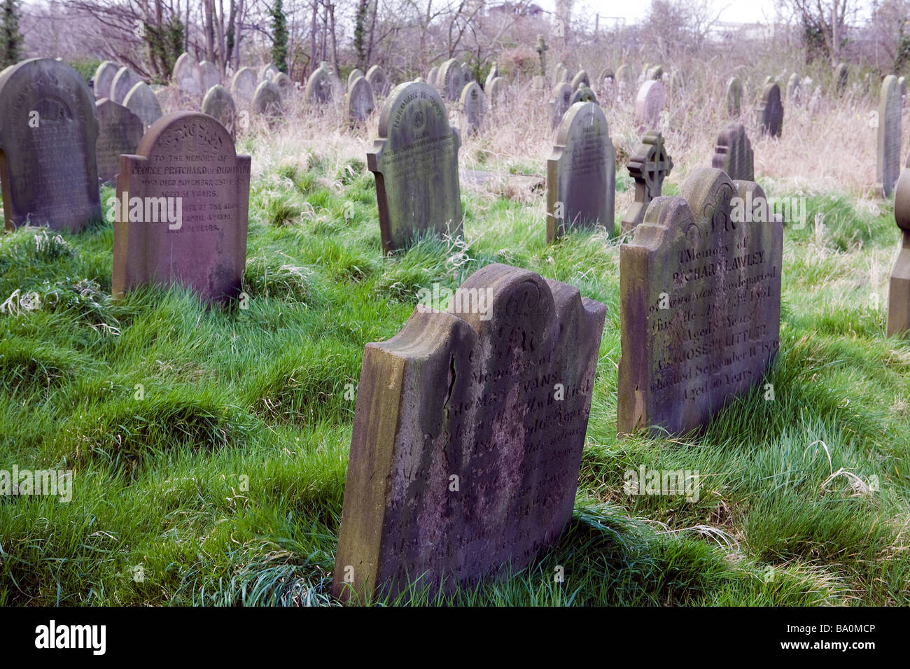 View across a grave yard showing the grave stones disappear into the ...