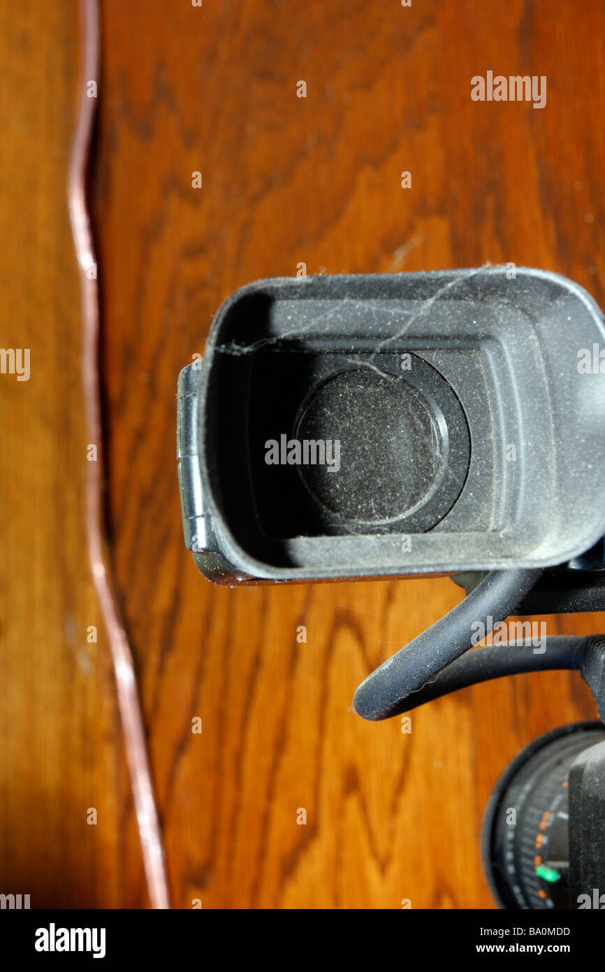 Dusty video camera viewport eyecup and wood grain with wire Stock Photo ...